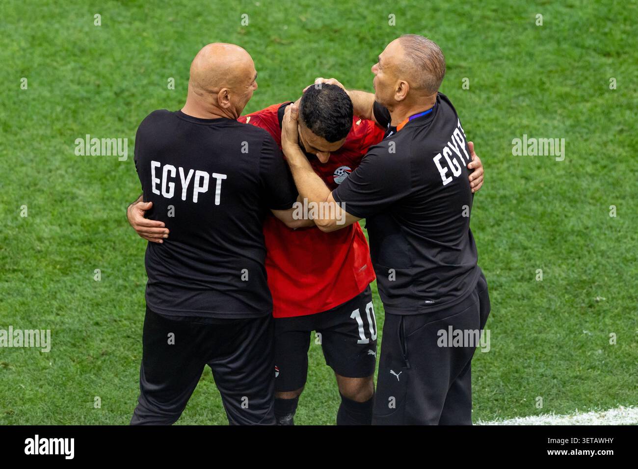 Egypt‚Äôs Mohamed Salah (10) is embraced by his coaches after ...