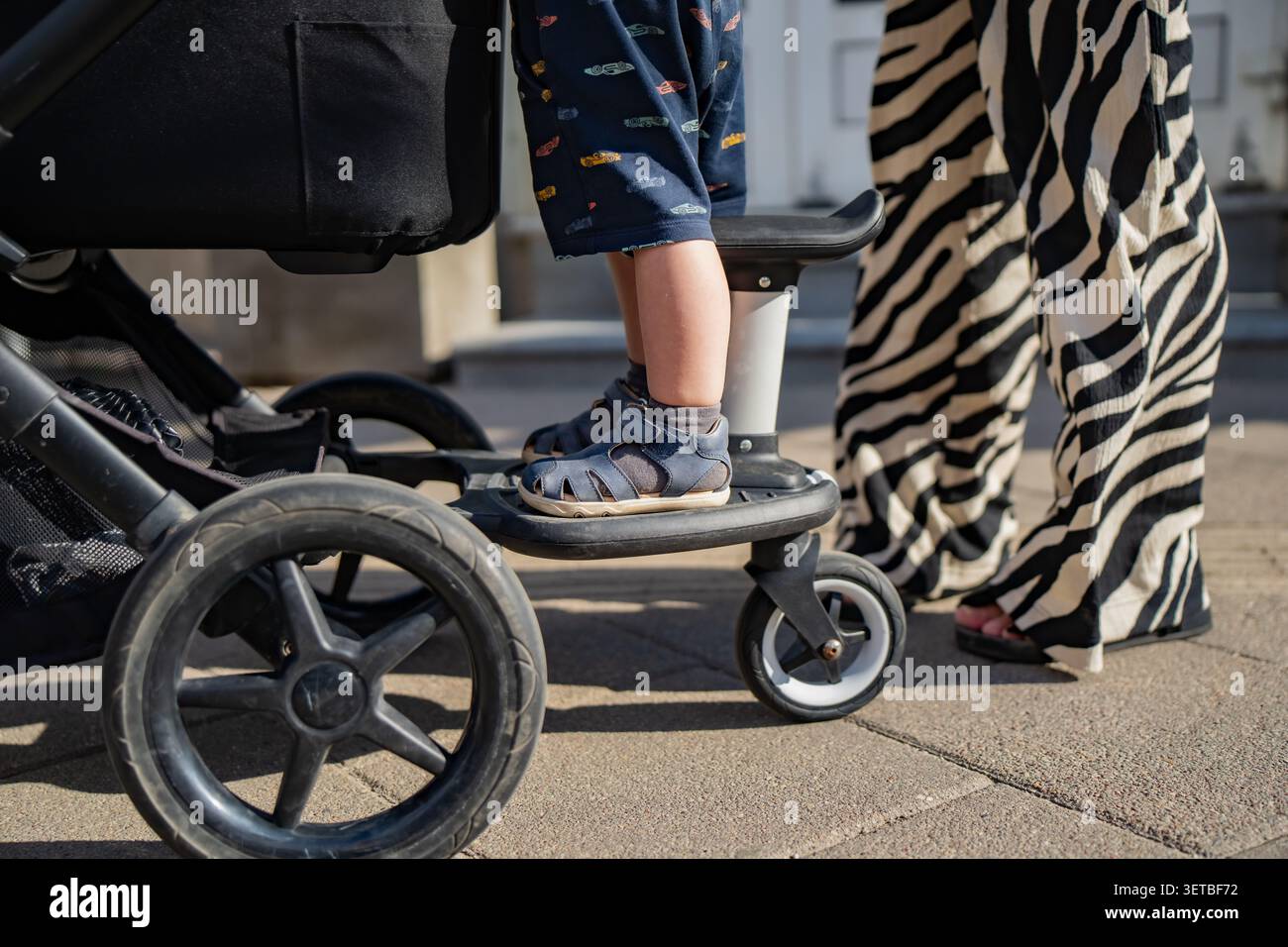 Conceptual urban parenting view showcasing a sibling step platform ...