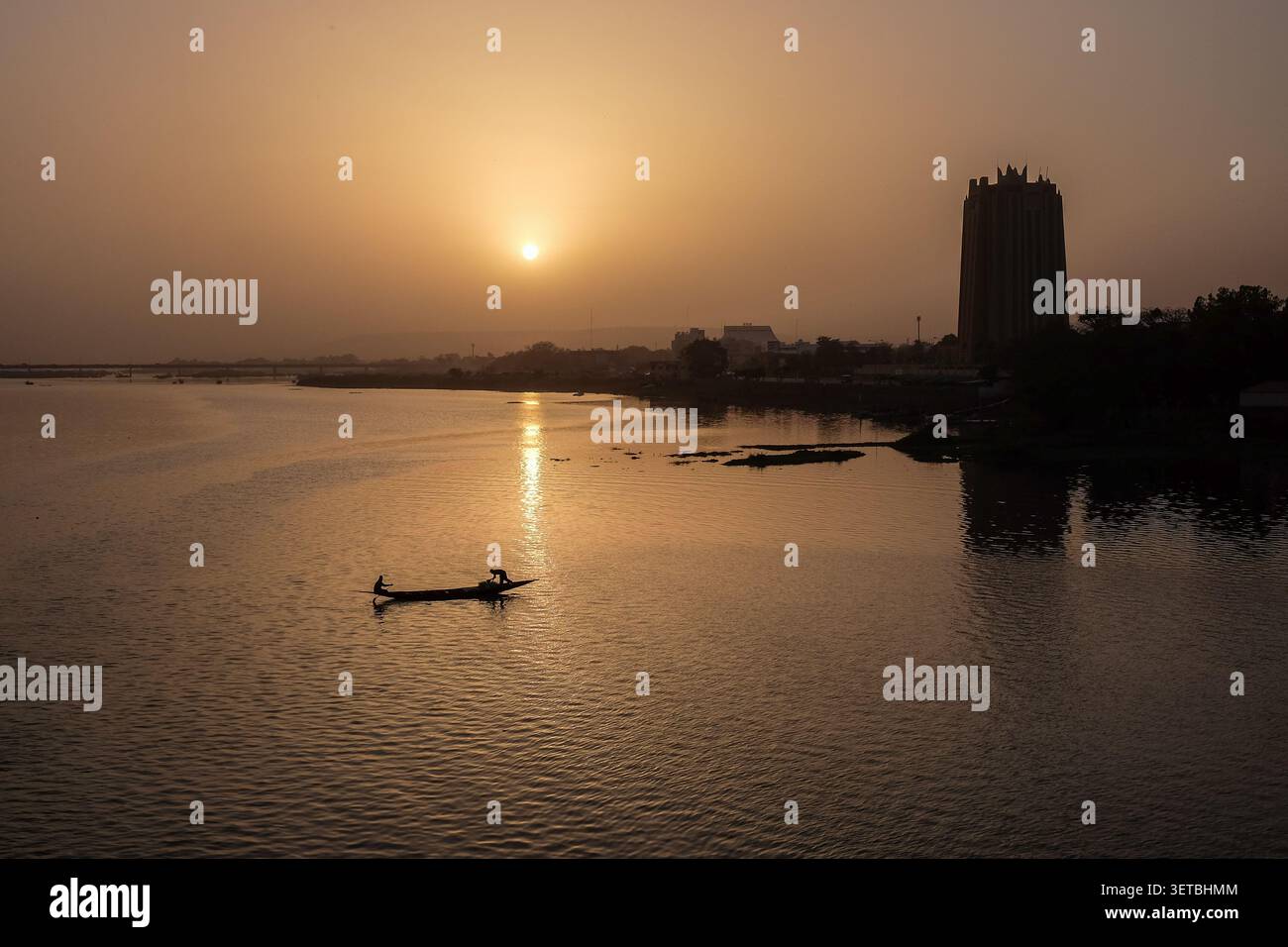 Sunset over the River Niger and the BCEAO Tower (on the right) in ...