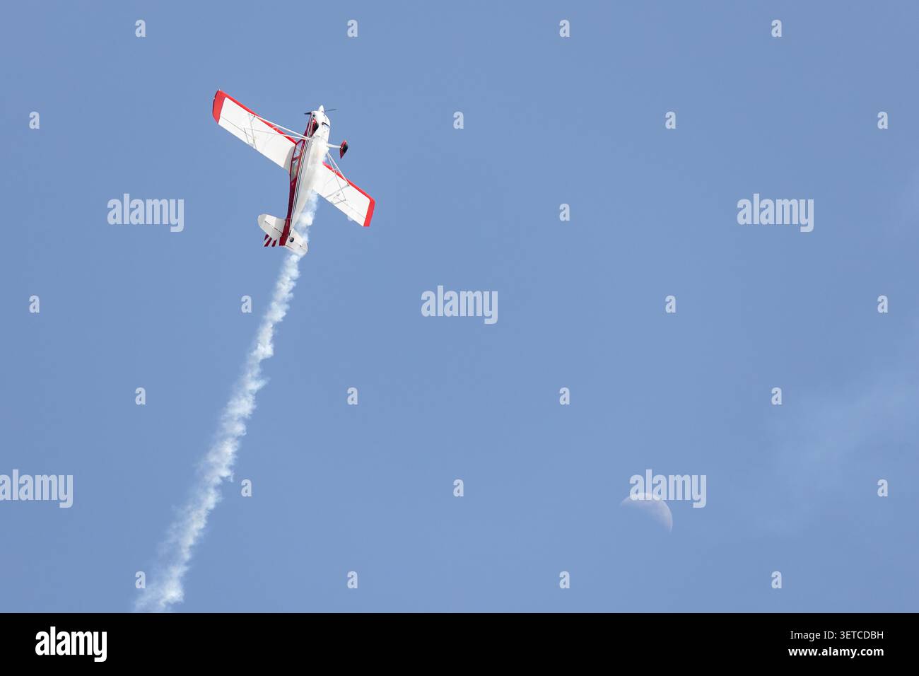PA red and white aerobatic aircraft performs a manoeuvre during the Air ...