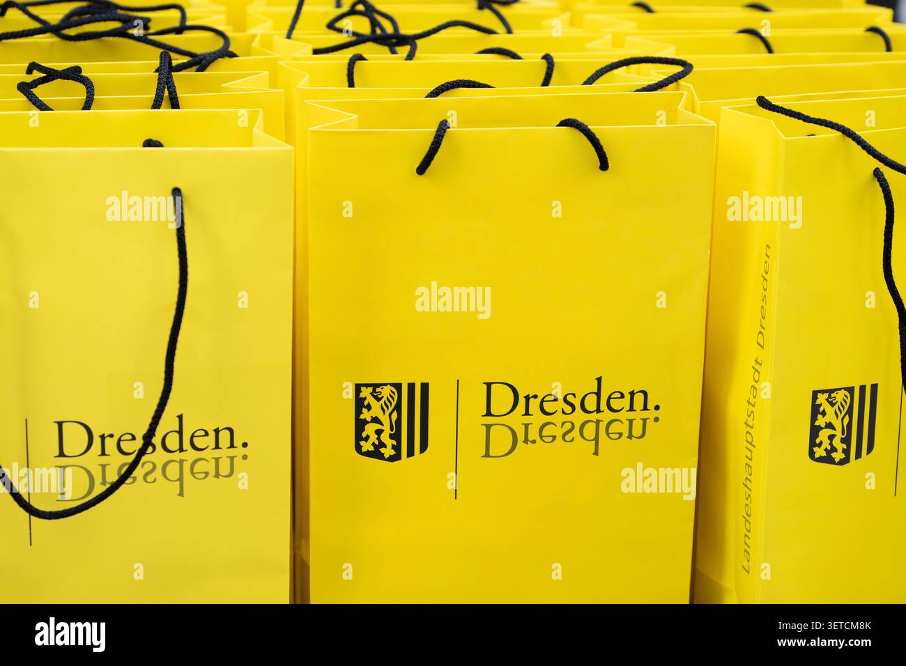 22 June 2026, Saxony, Dresden: Paper bags bearing the Dresden coat of ...