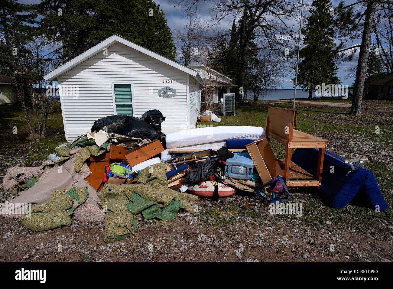 Damaged materials from the home of John Solum from recent floods at ...