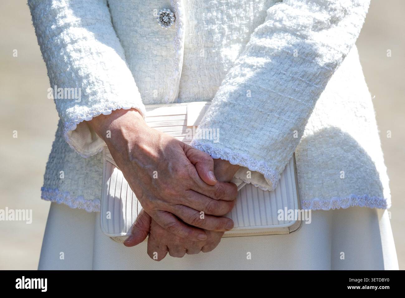 Japan's Empress Masako holds her handbag during a state visit at the ...