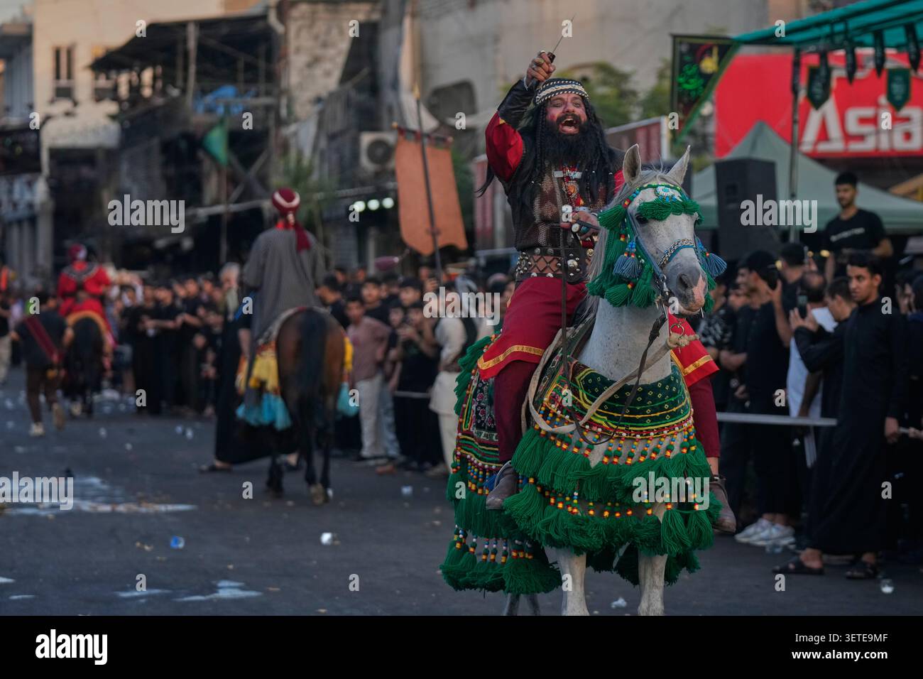 Iraqi Shiite wear traditional clothes to perform the epic of Imam ...