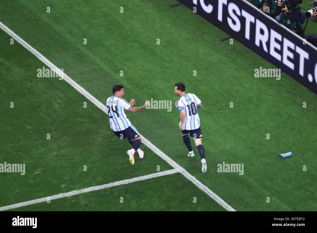 Argentina's Enzo Fernandez (24) celebrates with Argentina's Lionel ...