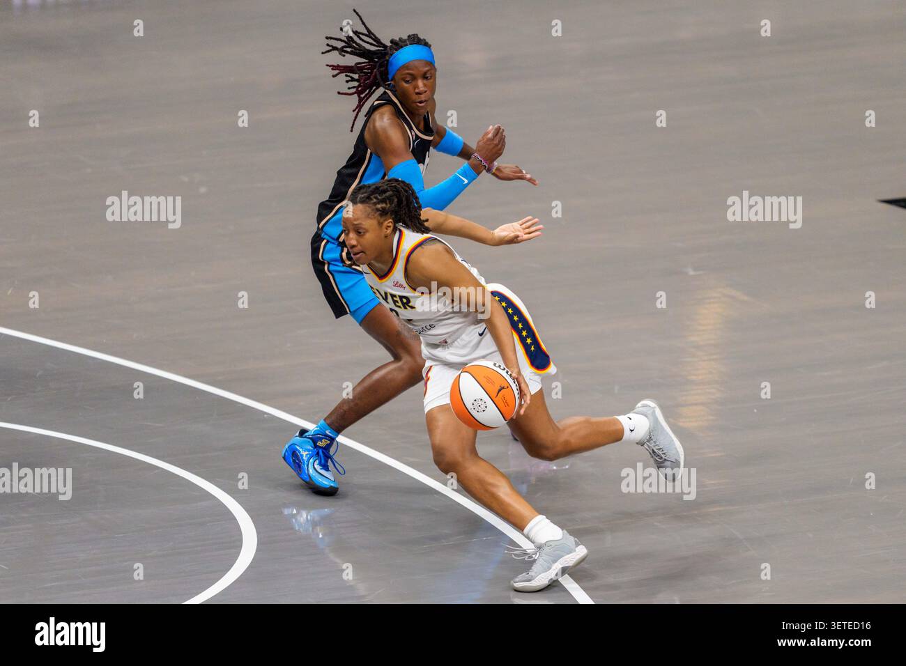 ATLANTA, GA - JUNE 20: Kelsey Mitchell #0 of the Indiana Fever dribbles ...