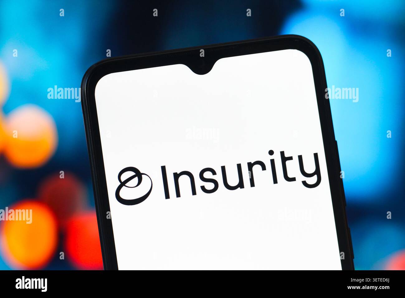 In this photo illustration, the Insurity logo is seen displayed on a ...