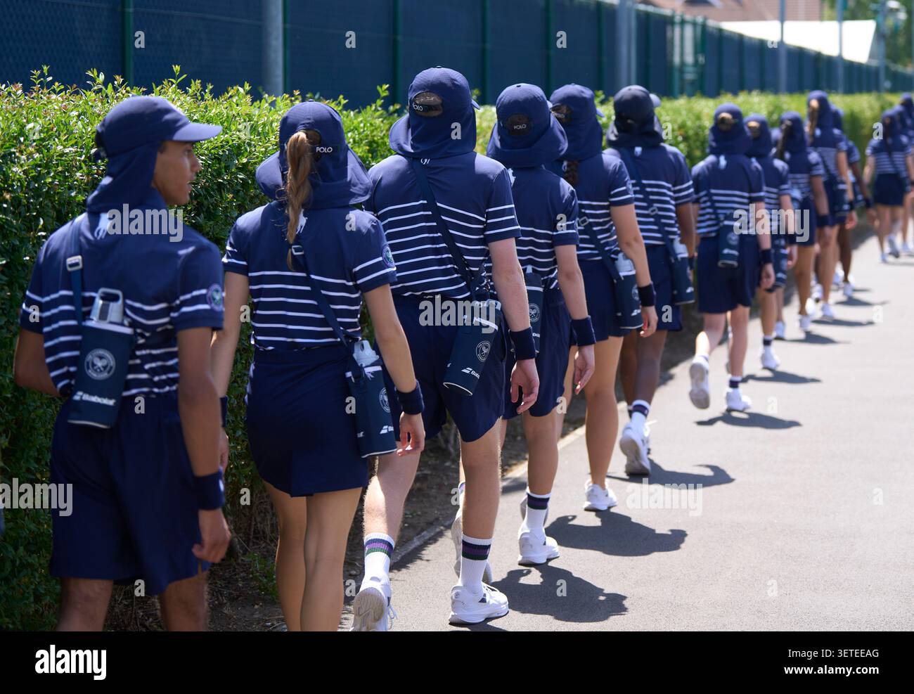 LONDON, - JUNE 22: Ball boys and girls moving between courts during the ...
