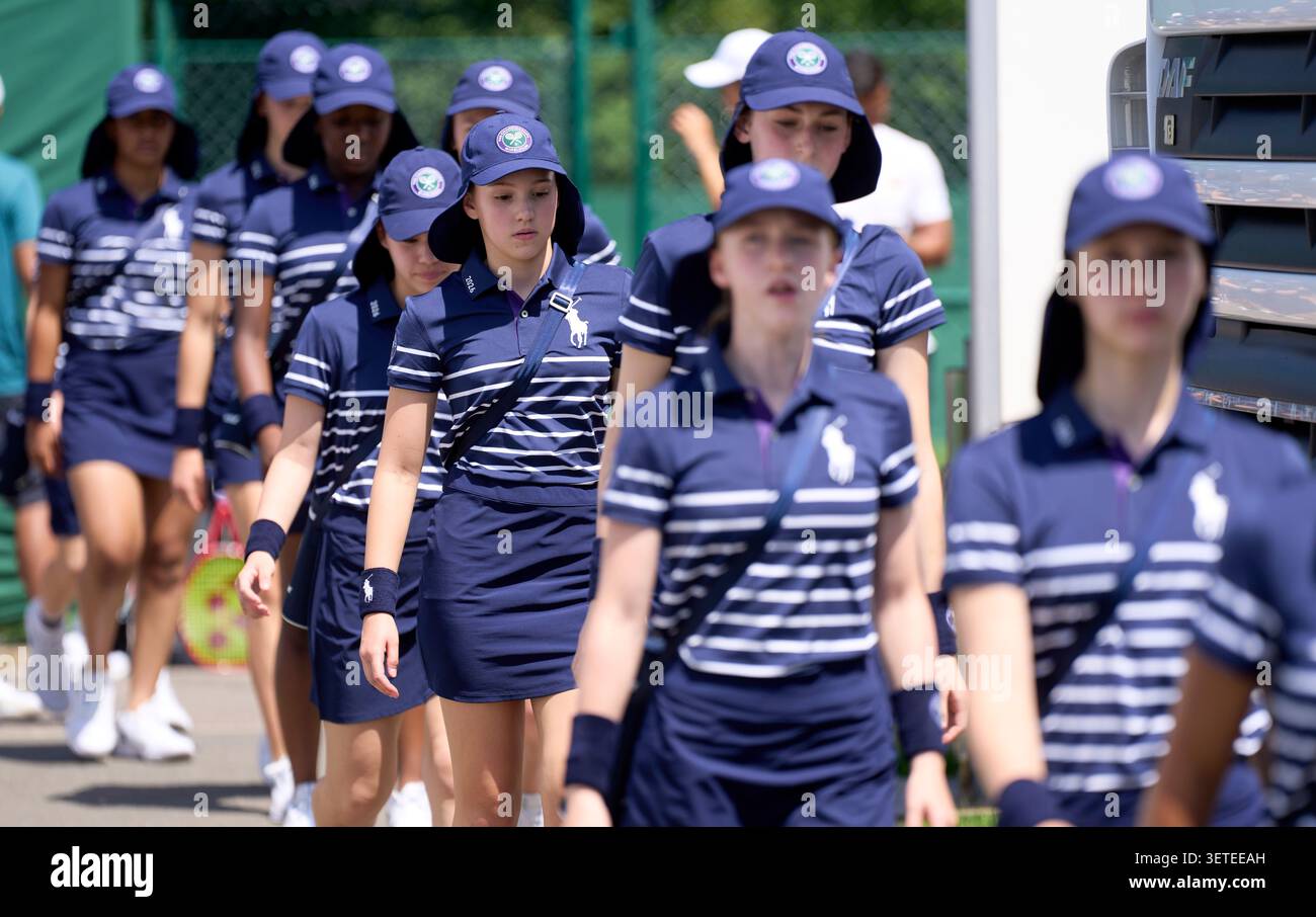 LONDON, - JUNE 22: Ball boys and girls moving between courts during the ...