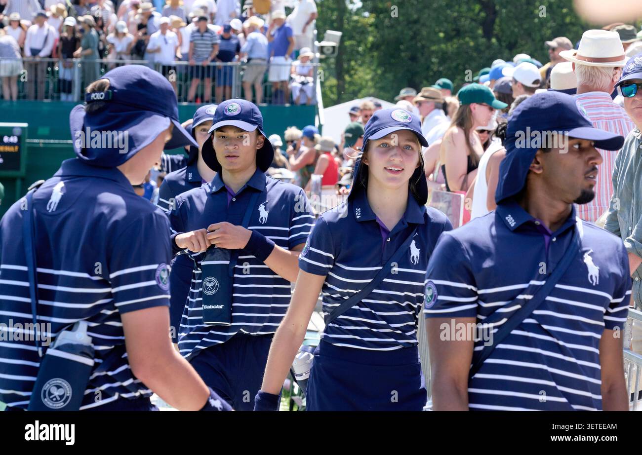 LONDON, - JUNE 22: Ballboys & Ballgirls moving between courts during ...