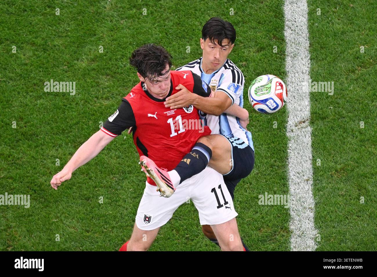Argentina's Lisandro Martinez, right, and Austria's Michael Gregoritsch ...