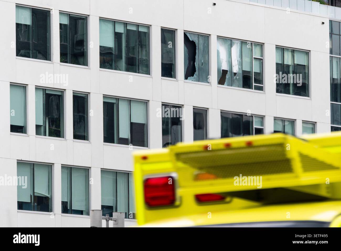 Broken windows are seen at the scene of a shooting in Montreal on ...