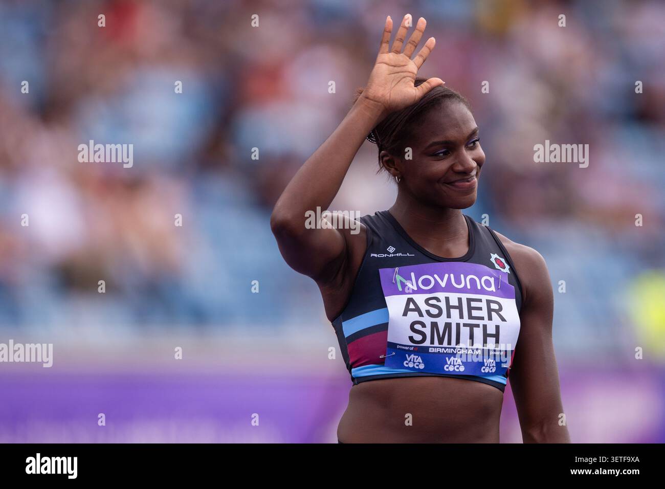 Dina Asher Smith waves to the crowd ahead of the Womens 200m heats at ...