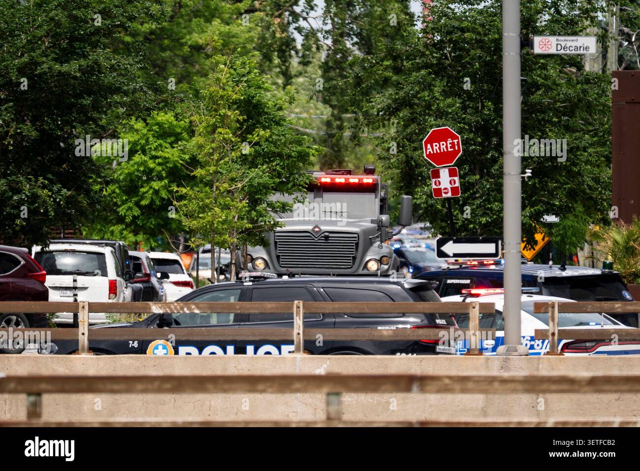 Montreal police work the scene of a shooting in Montreal on Monday ...