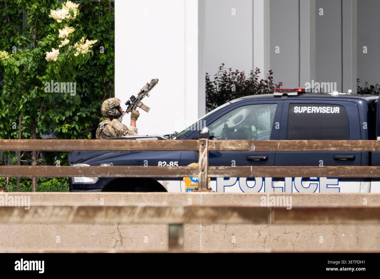 Montreal police work the scene of a shooting in Montreal on Monday ...