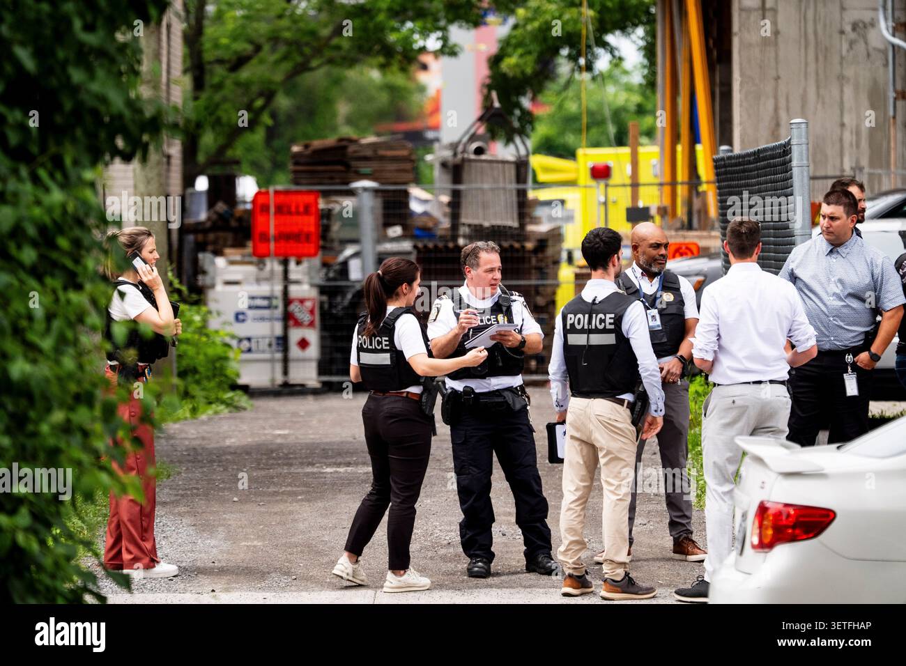 Montreal police work the scene of a shooting in Montreal on Monday ...