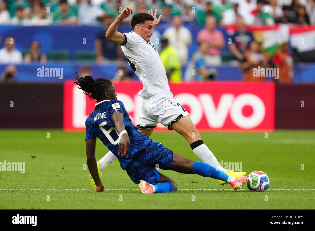 France's Manu Kone (6) and Iraq's Zaid Ismael (24) fight for the ball ...