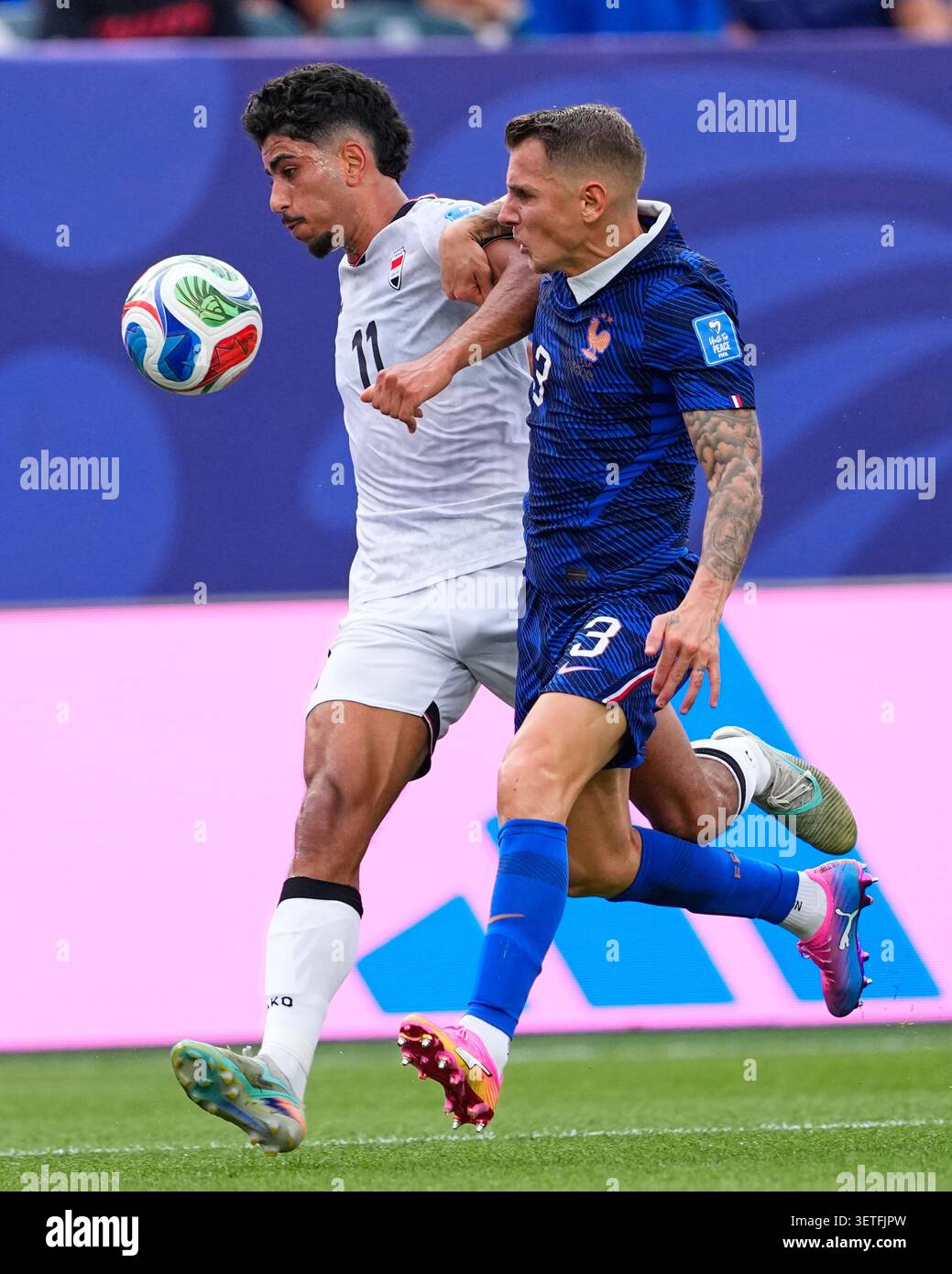 Iraq's Ahmed Qasim (11) and France's Lucas Digne (3) battle for the ...