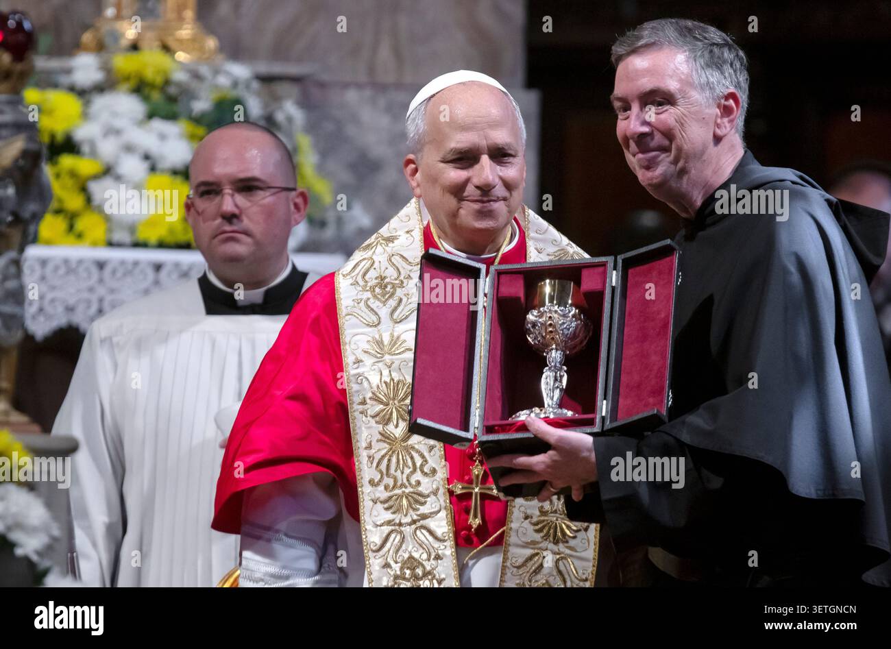 Pope Leo XIV presents a chalice to Father Joseph L. Farrell, Prior ...