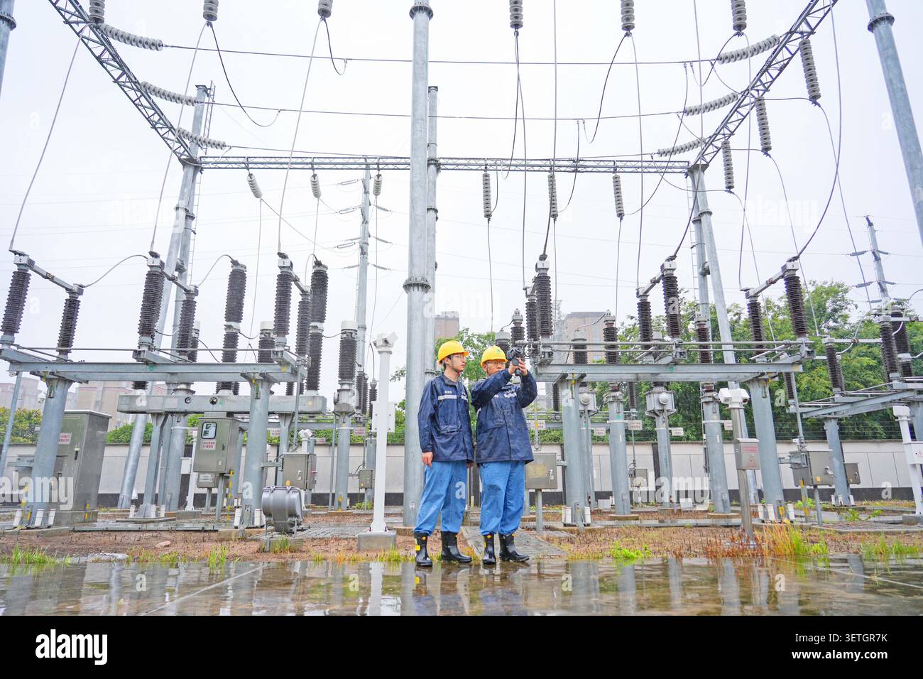Power workers inspect flood prevention equipment at 110kV Shuangtang ...