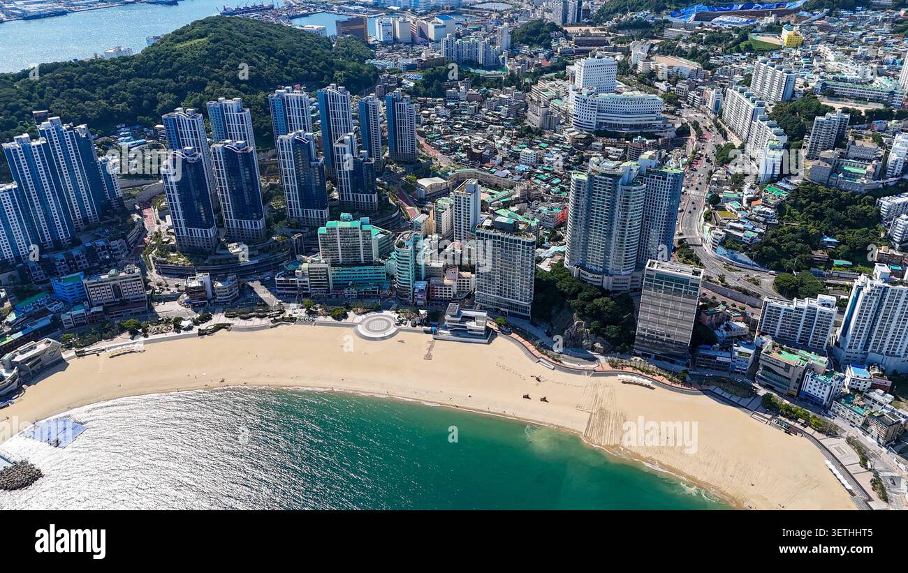 Aerial view capturing songdo beach with high rise buildings, blue ocean ...