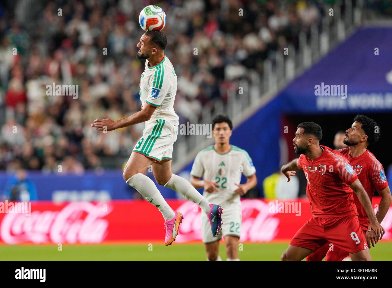 Algeria's Nabil Bentaleb (19) jumps to head the ball during the World ...