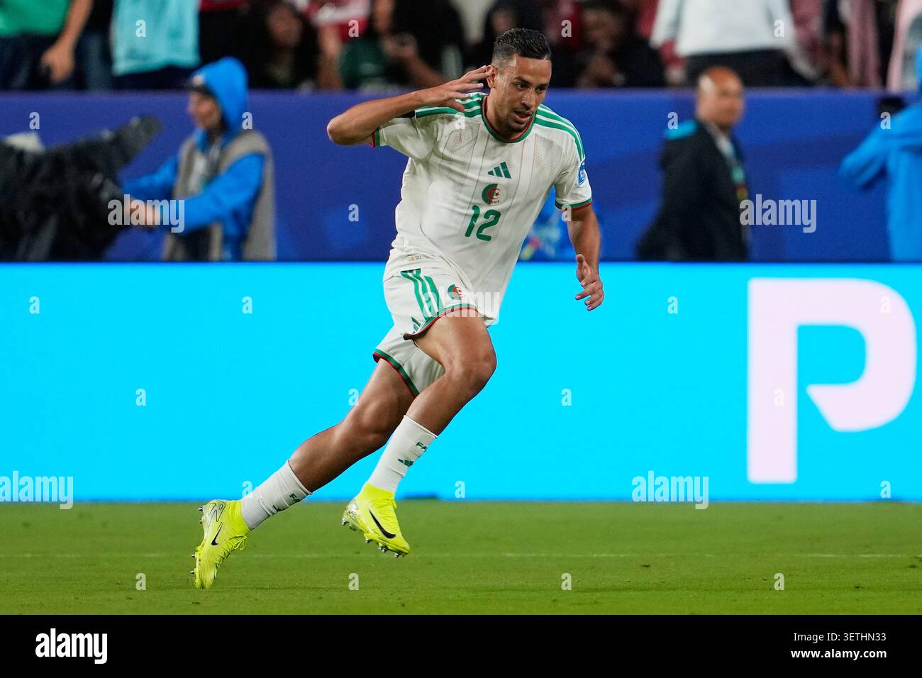 Algeria's Nadhir Benbouali (12) celebrates after scoring his side's ...