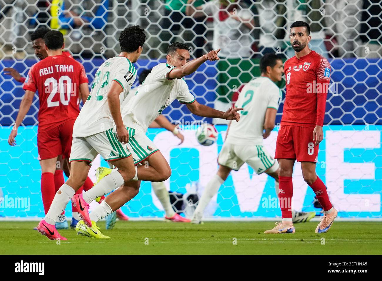 Algeria's Nadhir Benbouali (12) celebrates after scoring his side's ...