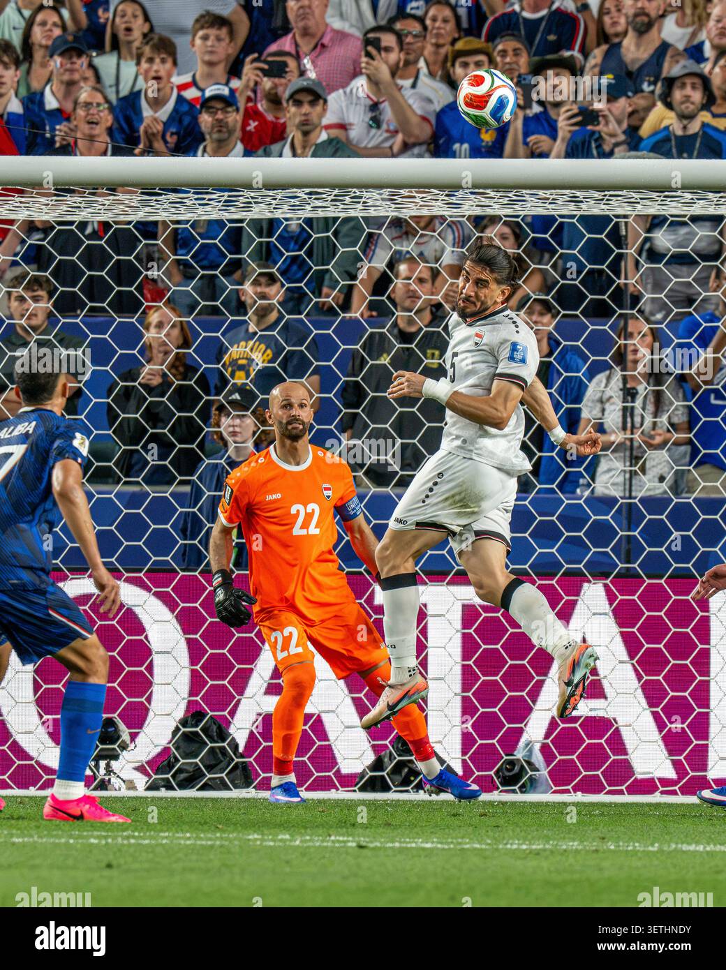 Akam Hashim (#5) heads the ball away for Iraq in the World Cup match vs ...