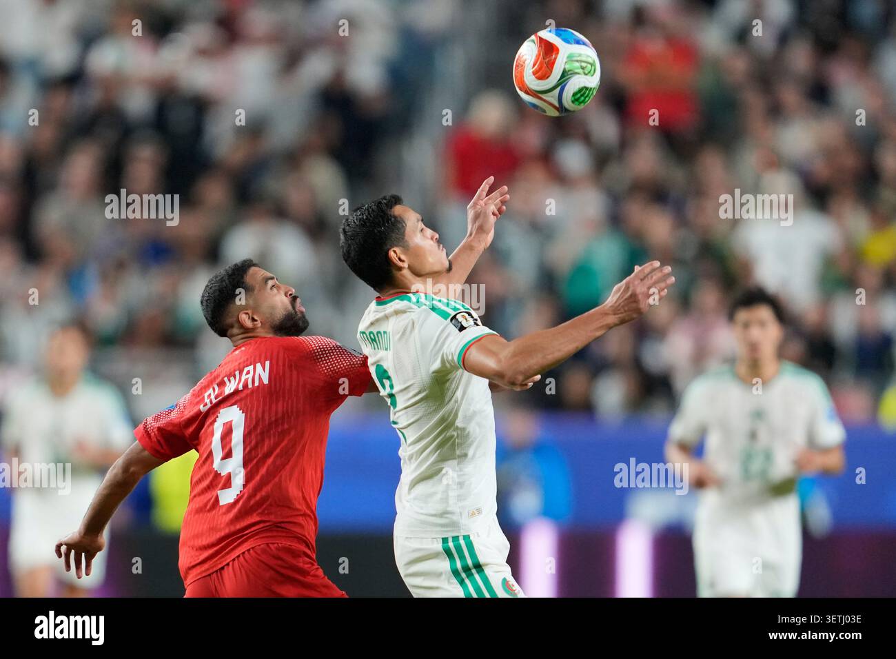 Algeria's Aissa Mandi (2) battles for the ball with Jordan's Ali Olwan ...