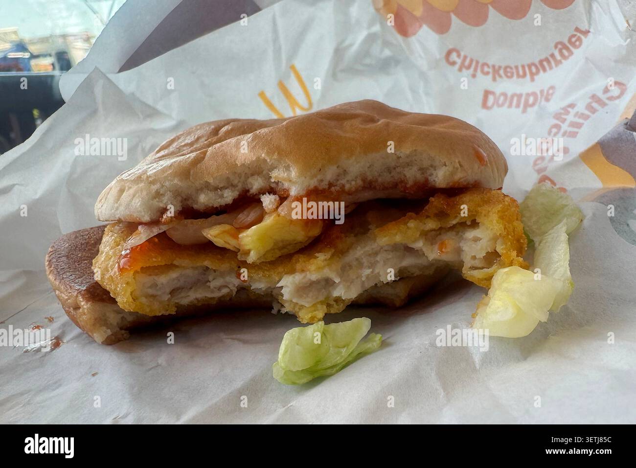 An incomplete burger from the fast food chain, McDonald's, quick ...