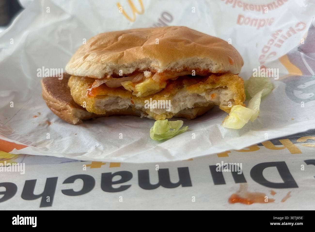 An not fully eaten burger from the fast food chain, McDonald's, quick ...