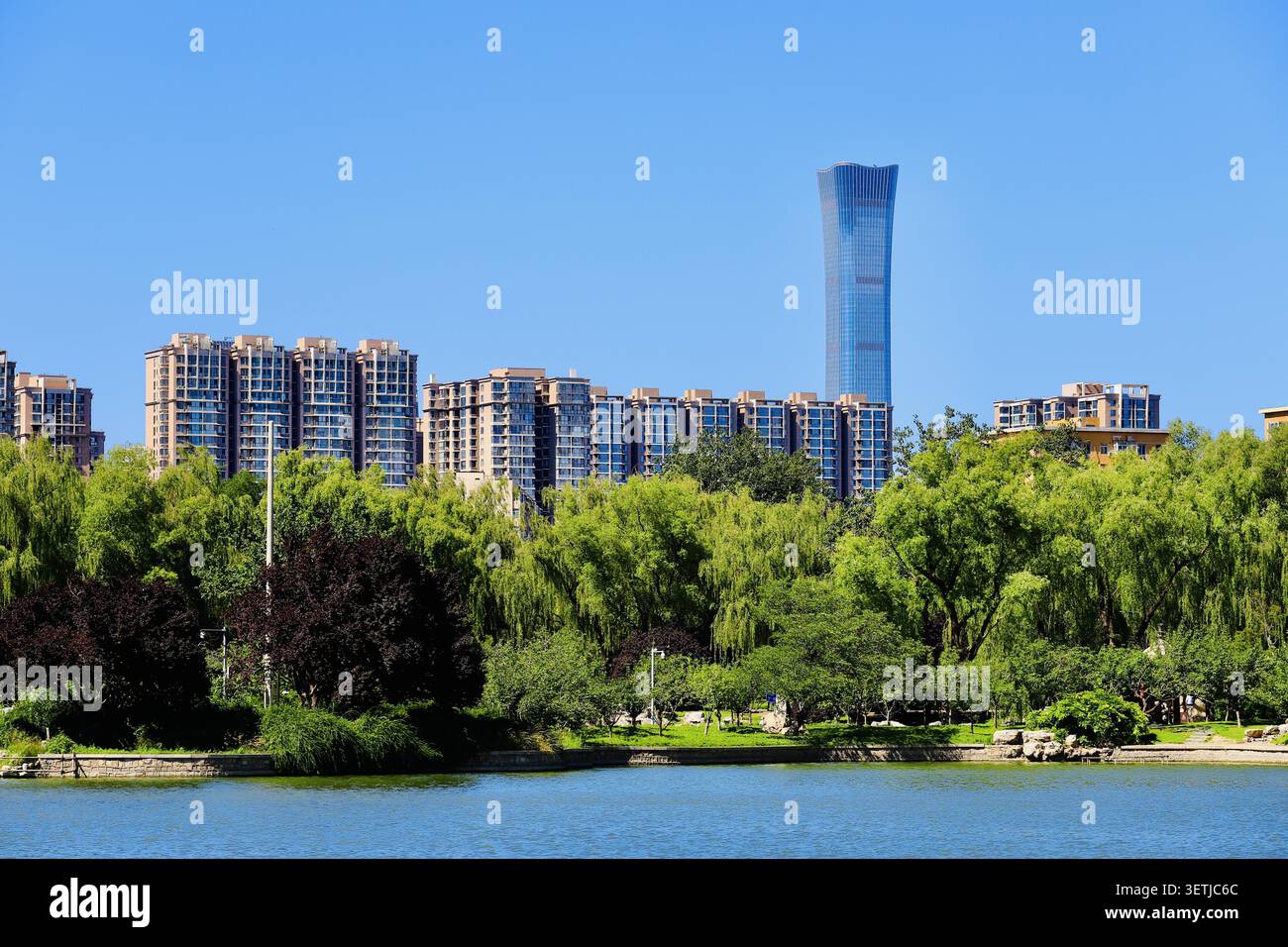 Visitors enjoy boating in Longtan Park with a view of China Zun in ...