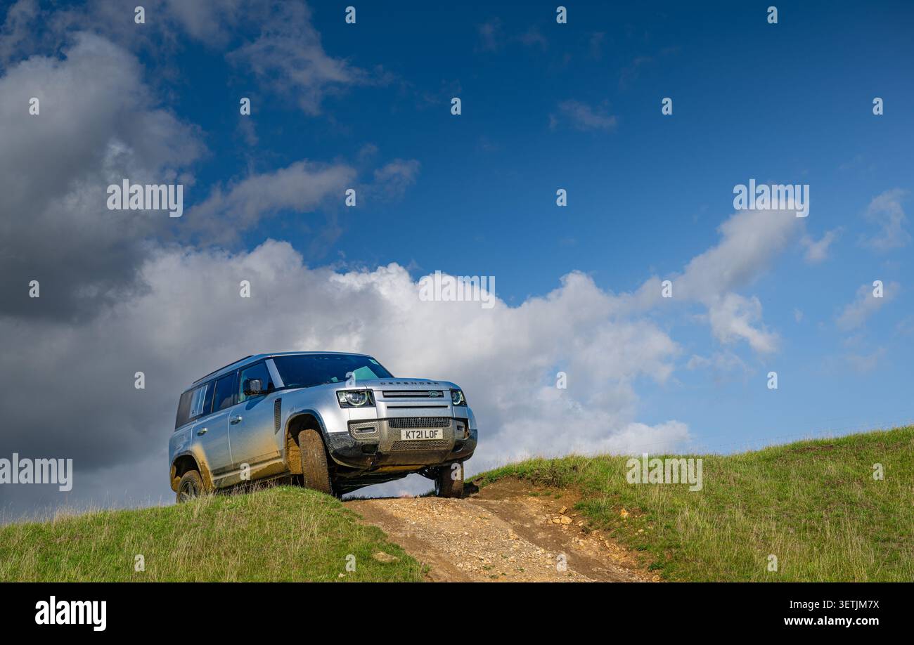 Land Rover Discovery parked beneath a clear blue sky in the countryside ...