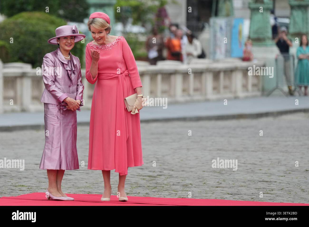 Belgium's Queen Mathilde, right, speaks with Japan's Empress Masako as ...