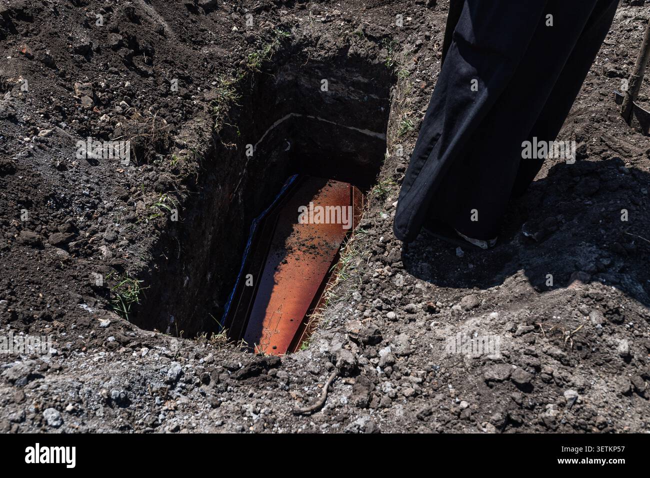 Relatives attend to the funeral of Roman Godina, a 39-year-old ...