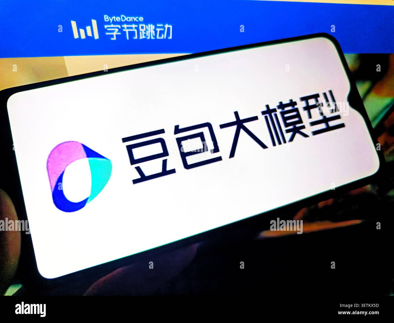 SUQIAN, CHINA - JUNE 23, 2026 - A netizen is using his mobilephone to ...