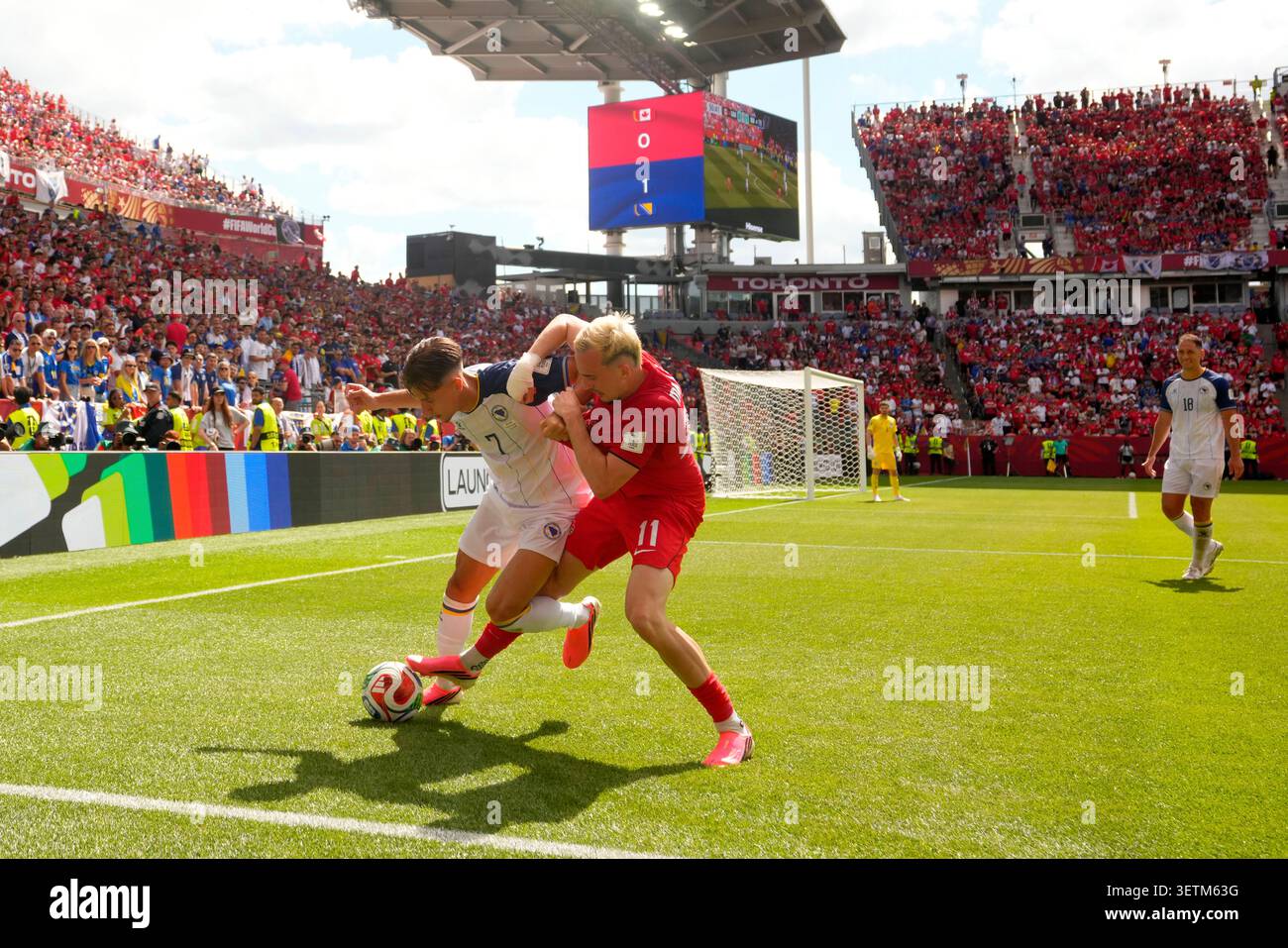 Bosnia and Herzegovina's Amar Dedic (7) and Canada's Liam Millar (11 ...