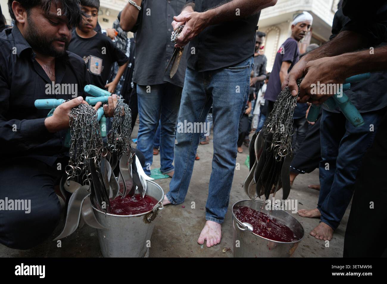 People clean chains, blades and knives after Shiite Muslims flagellate ...