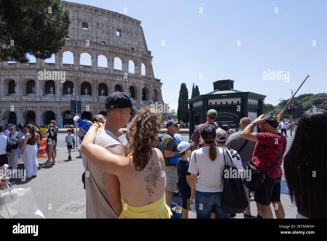 IPA85973541 - Tourists waiting in line at a water dispenser in front of ...