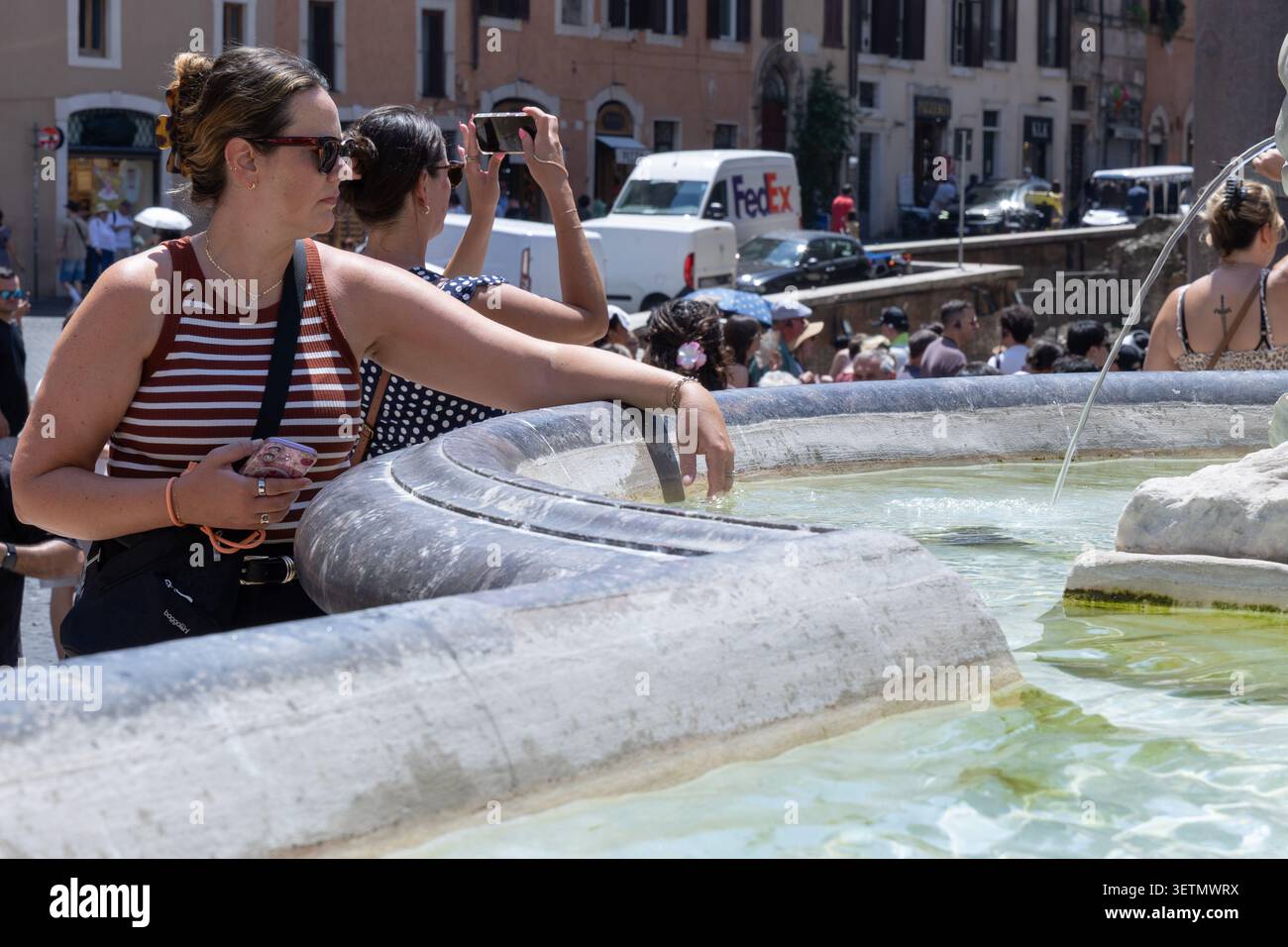 IPA85973501 - Tourists near the Pantheon Fountain seek relief from the ...