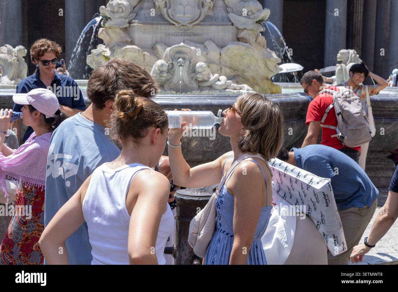 IPA85973497 - Tourists near the Pantheon Fountain seek relief from the ...