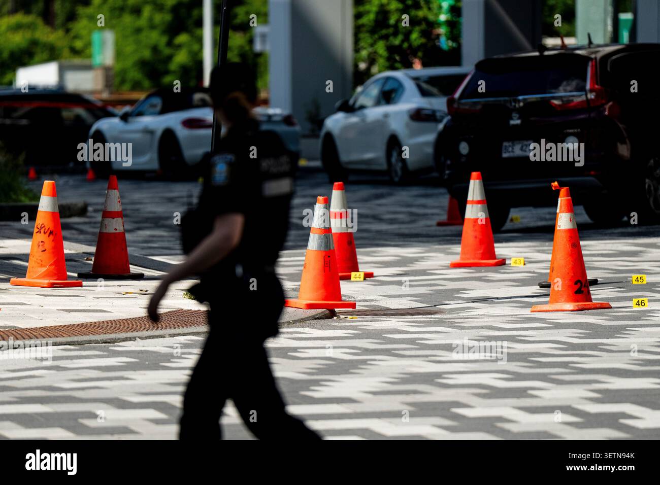 Montreal police work the scene of a shooting the day before, in ...