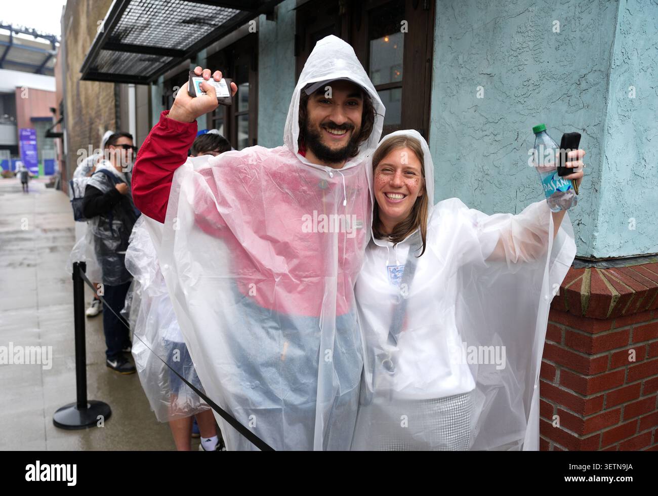 England fans in rain ponchos ahead of the FIFA World Cup Group L match ...
