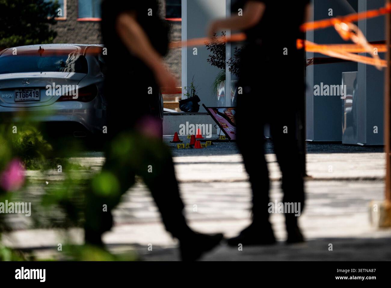 Montreal police work the scene of a shooting the day before, in ...