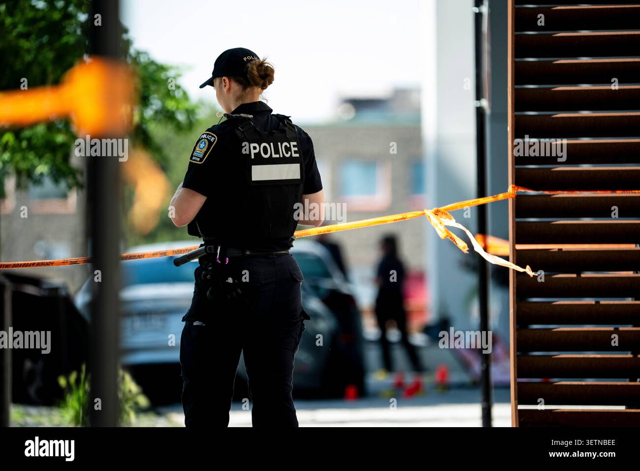 Montreal police work the scene of a shooting the day before, in ...