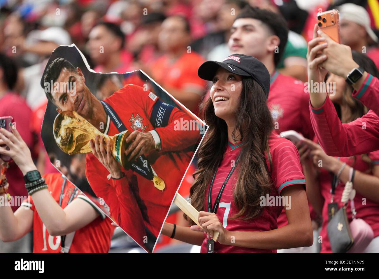 A fan of Portugal waits for the kickoff of the World Cup Group K soccer ...