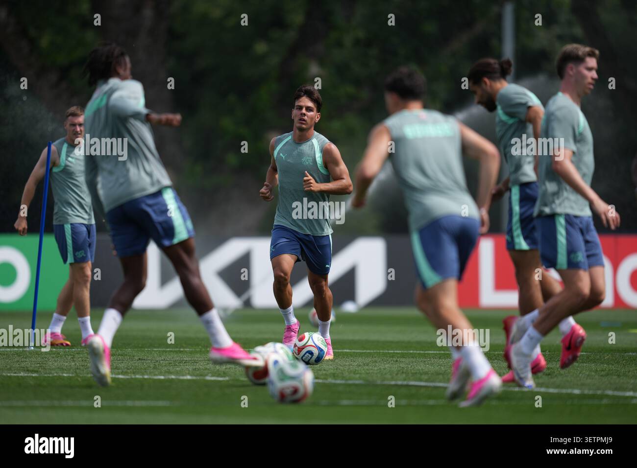 Switzerland's Ardon Jashari, middle, works out during a training ...