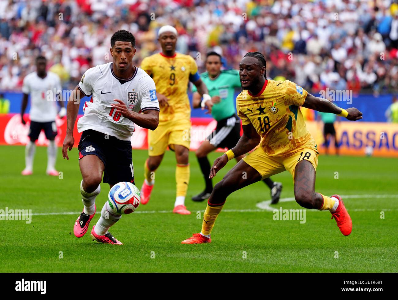 England's Jude Bellingham and Ghana's Jerome Opoku (right) battle for ...