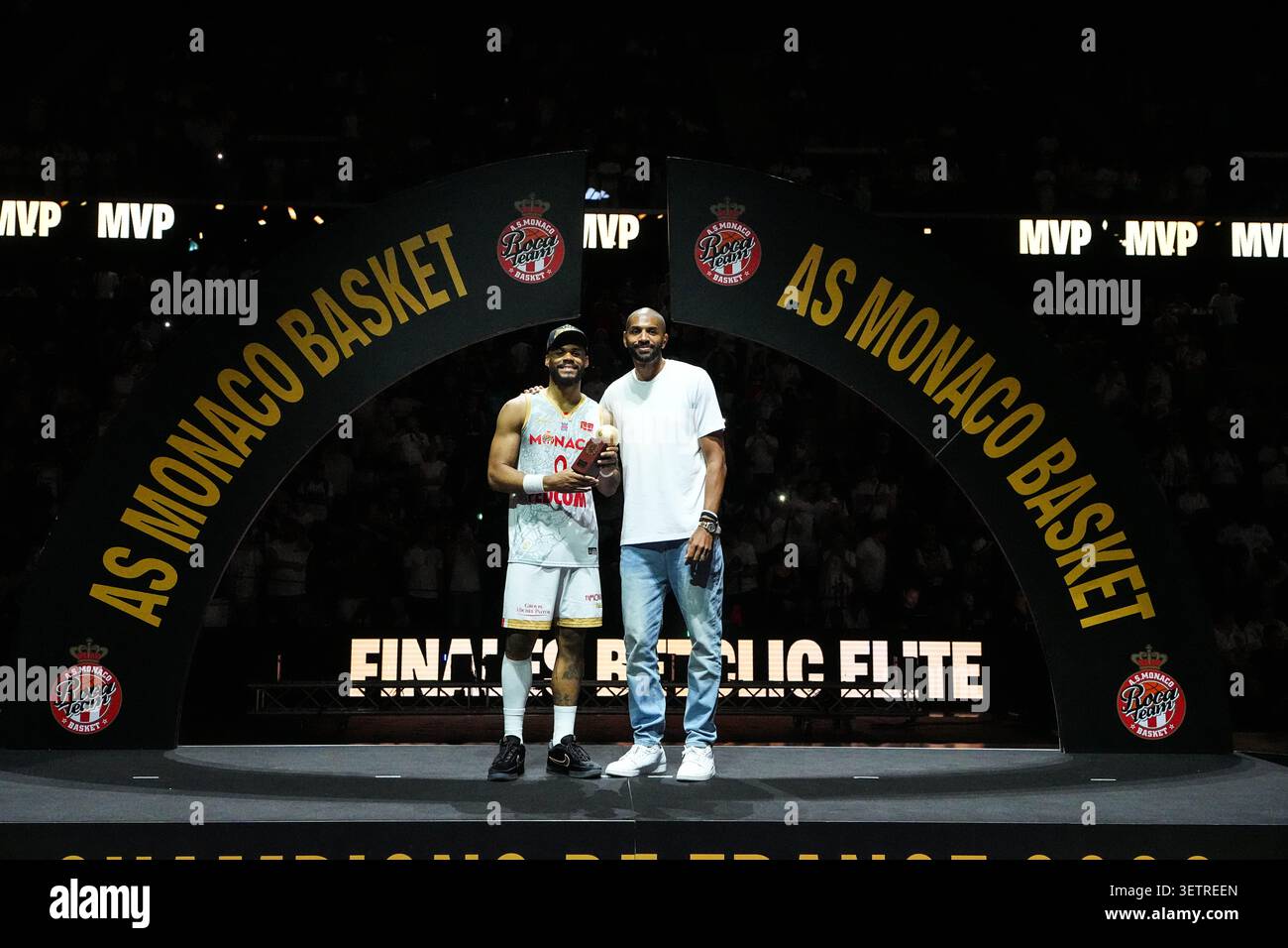 Elie OKOBO of Monaco receives finals map trophy from Nicholas BATUM ...